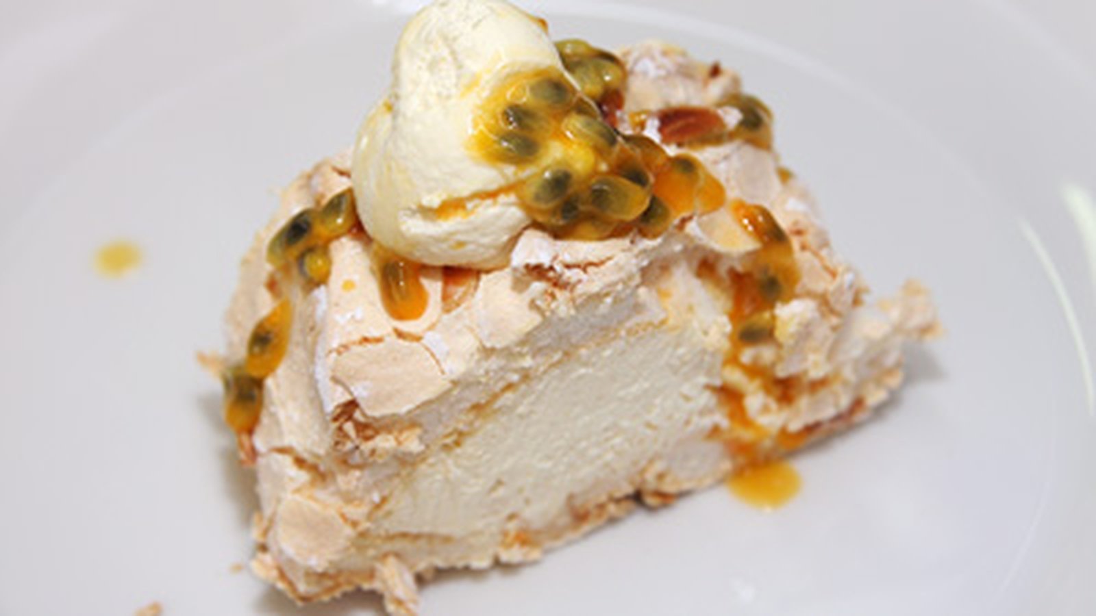 Passion Fruit and Lemon Meringue Roulade Served wi