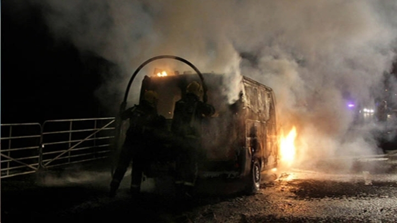 Three arrested over road safety van fire