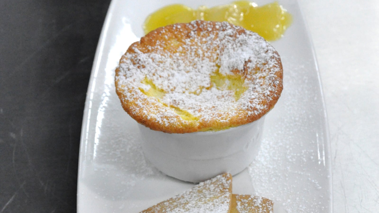 Lemon soufflé, sable biscuits with caramelised pears