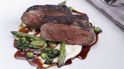 Rump of Spring Lamb in a Wild Mushroom Crust accompanied with pea purée ...