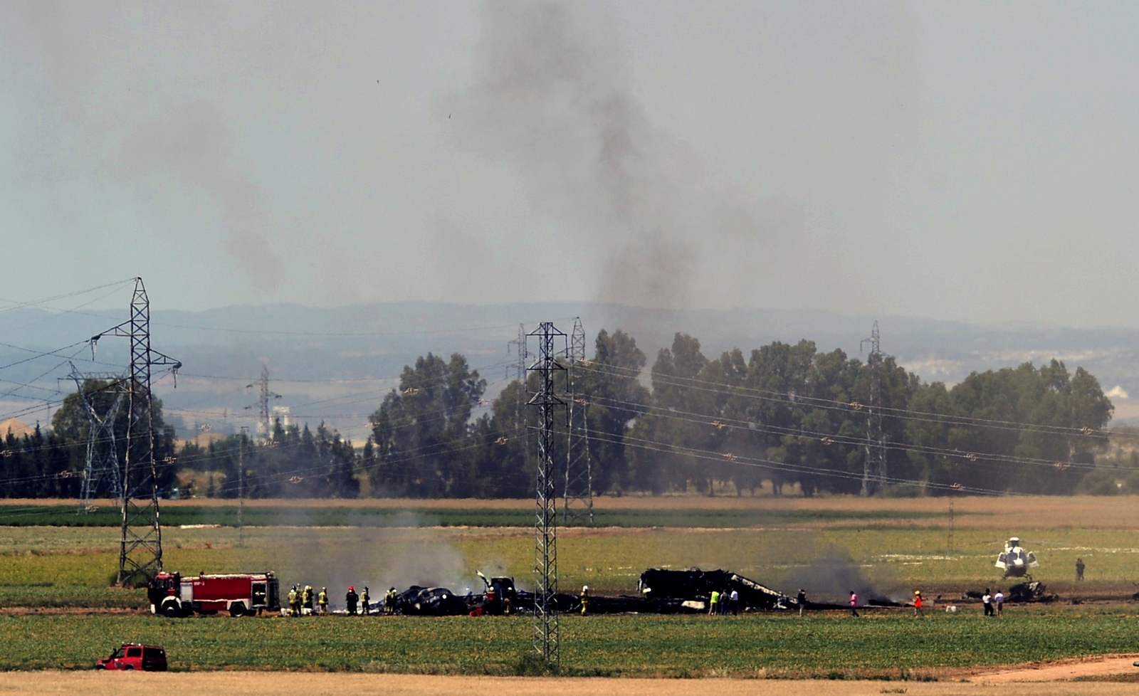 Military plane crashes into pylon killing four