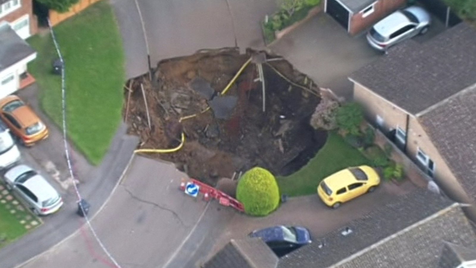 20m sinkhole opens in UK housing estate