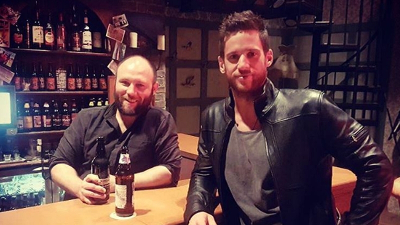 Home and Away's Dan Ewing enjoys a drink in Carrigstown