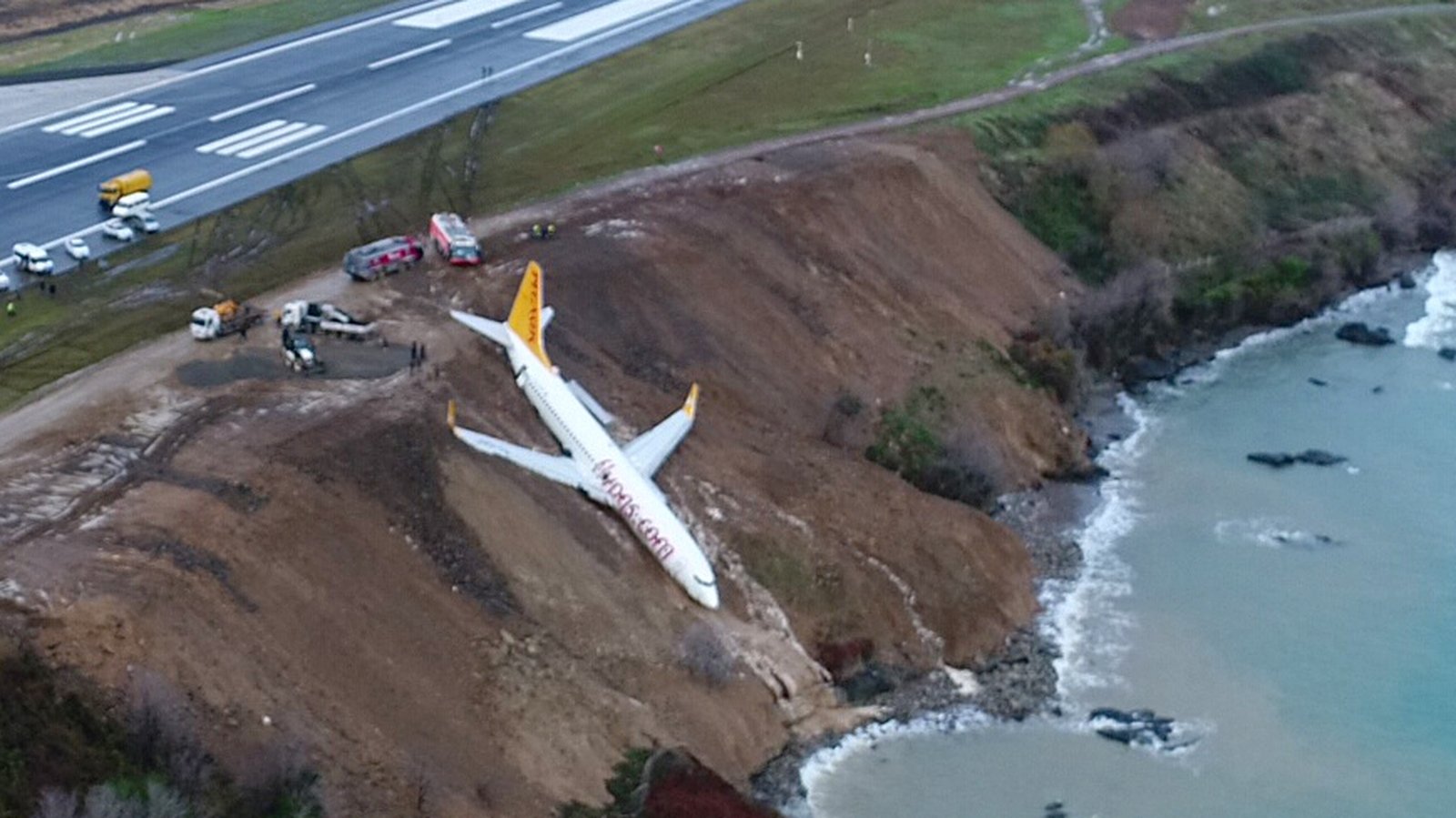 Turkish plane skids off runway onto seaside cliff