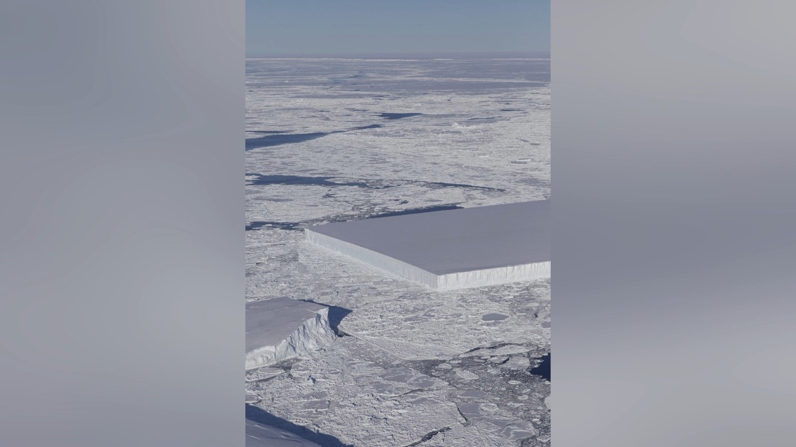 Iceberg floating in Antarctica is perfect rectangle