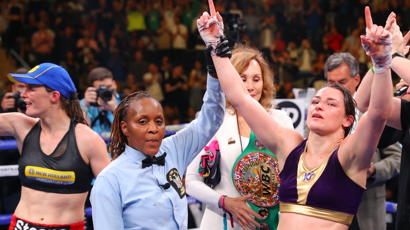 Taylor digs deep to become undisputed lightweight champ