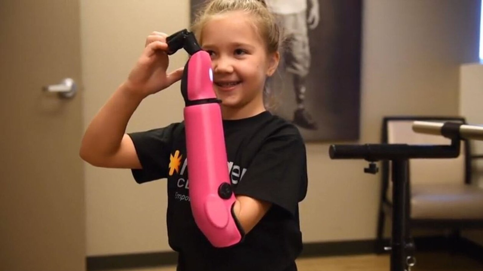 Eight-year-old gets to grips with bionic arm in US
