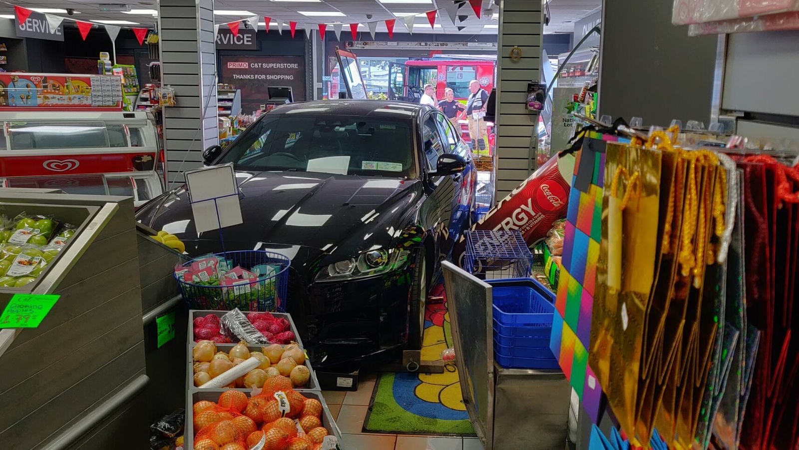 Owner thankful no one injured as car crashes into shop