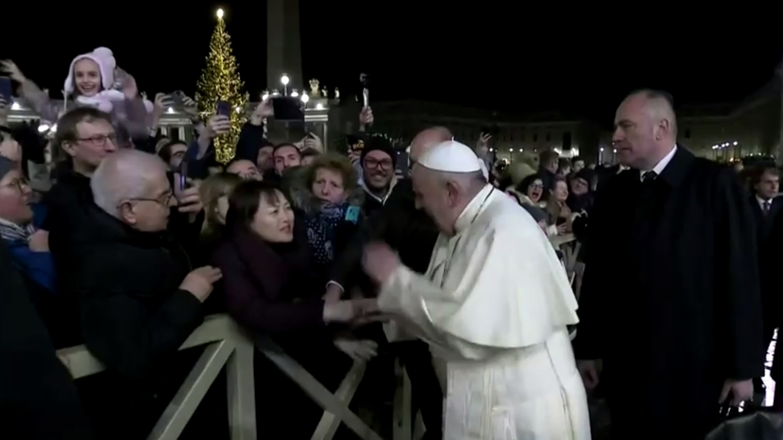 Pope sorry for slapping hand of woman who grabbed him