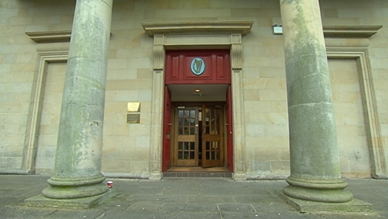 Man charged with coughing at garda