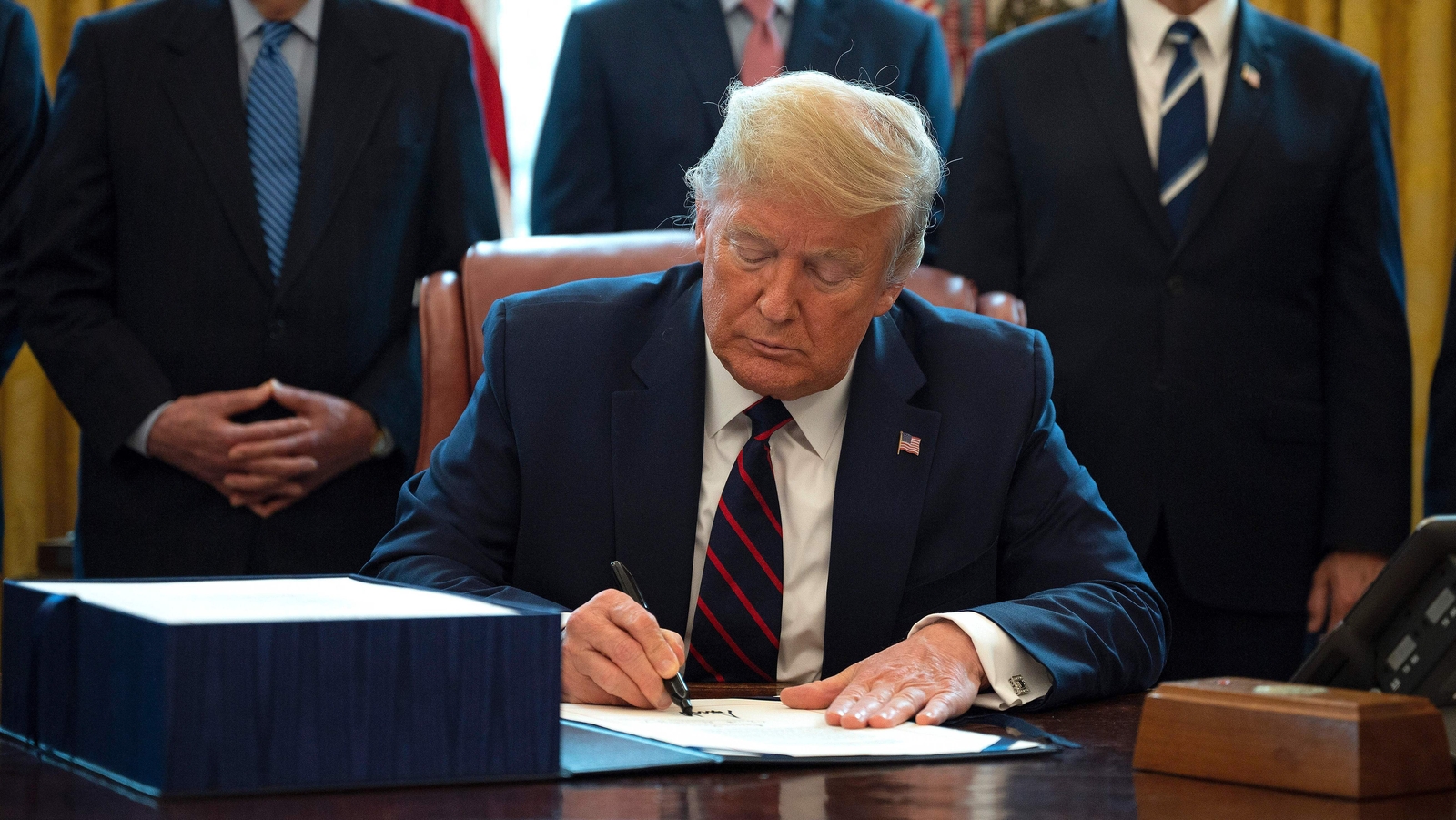 Trump signs two trillion dollar US virus recovery plan