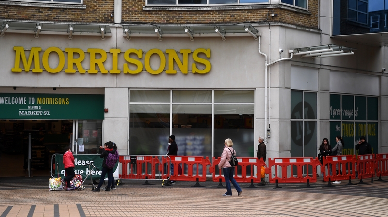UK supermarket Morrisons' profit halved by Covid costs