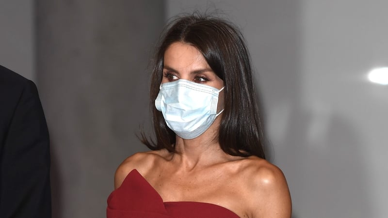 Queen Letizia of Spain pairs red cocktail dress with face mask