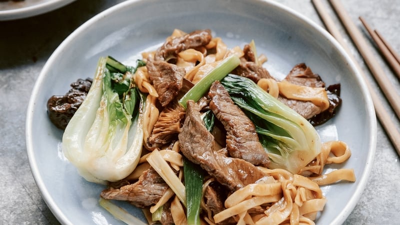 Wok-fried noodles with beef and pak choi