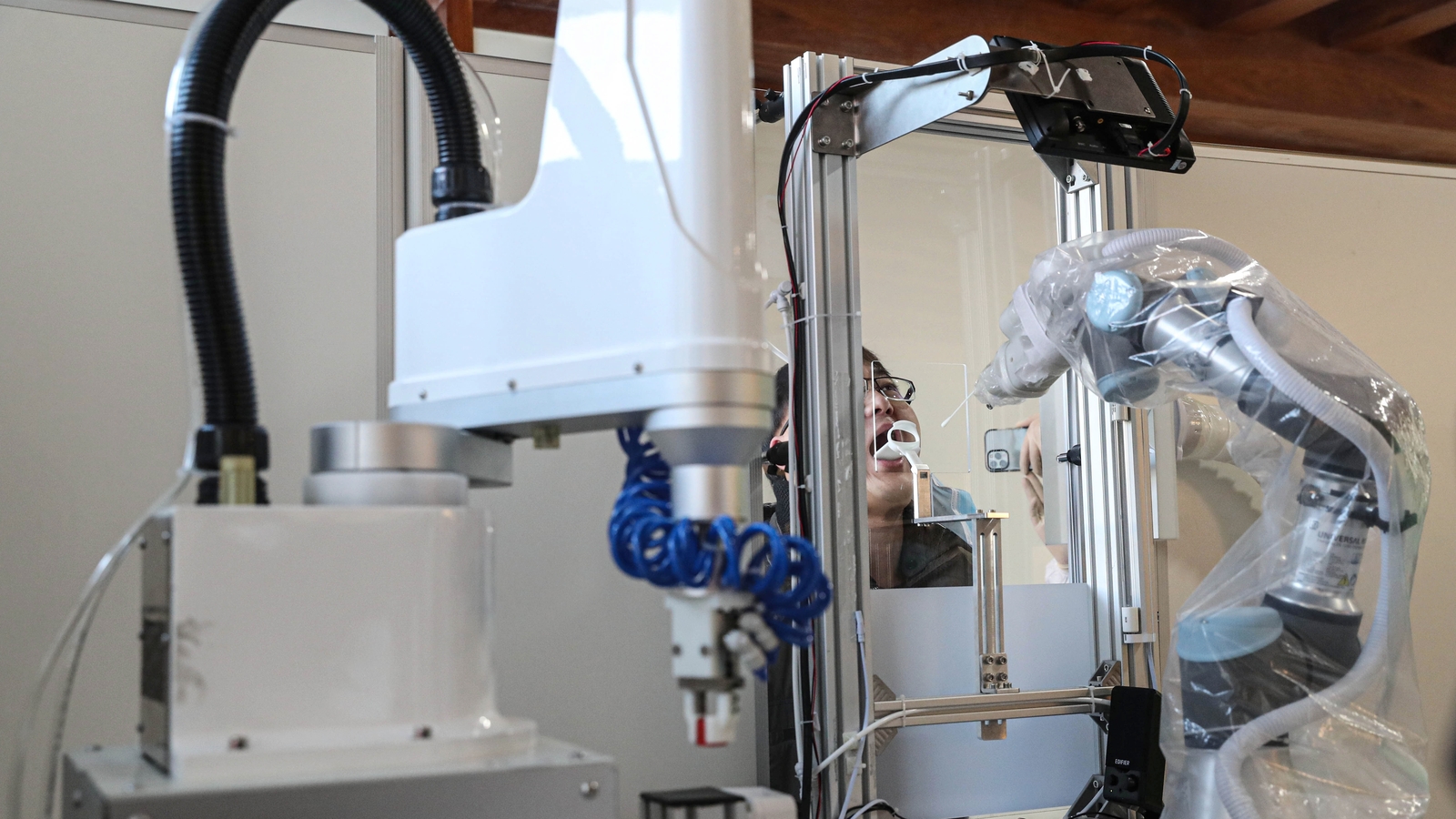 Robots take throat swabs to fight pandemic in China