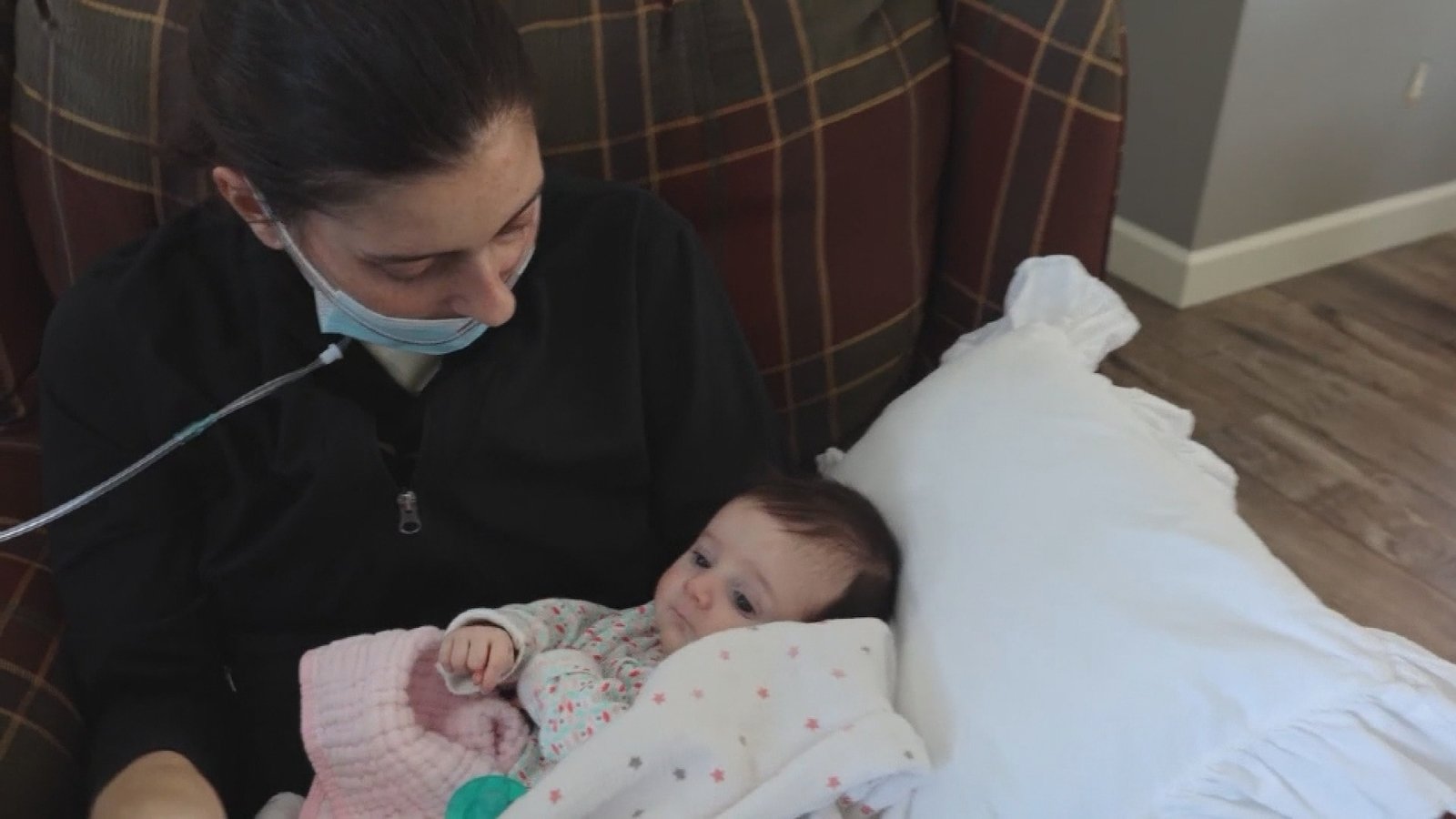 Woman meets newborn daughter after three months in coma