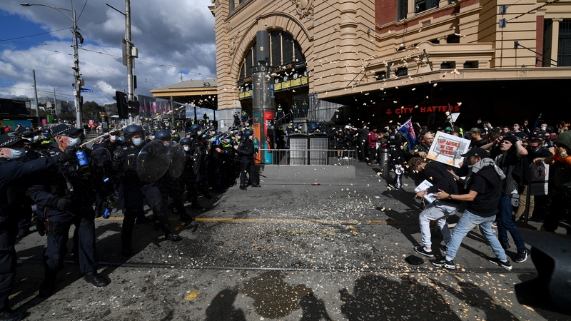 Anti-lockdown protesters and police clash in Australia