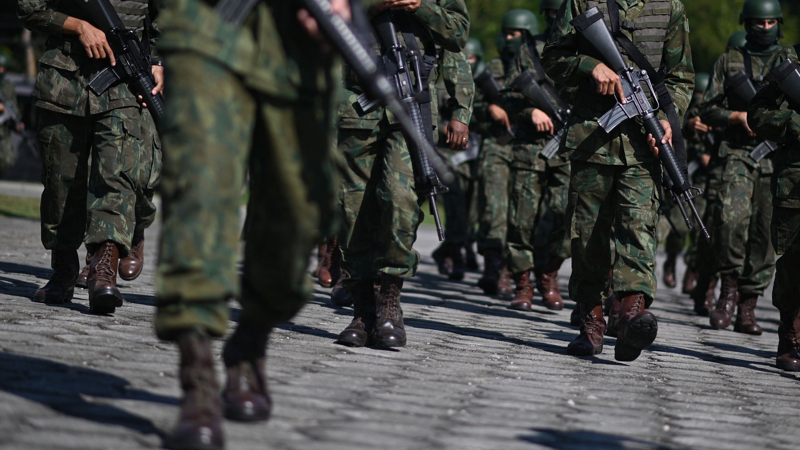 25 dead after raid on alleged Brazil bank robbers