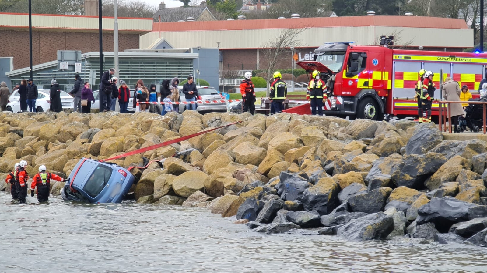 Emergency services tow car from beach in Salthill