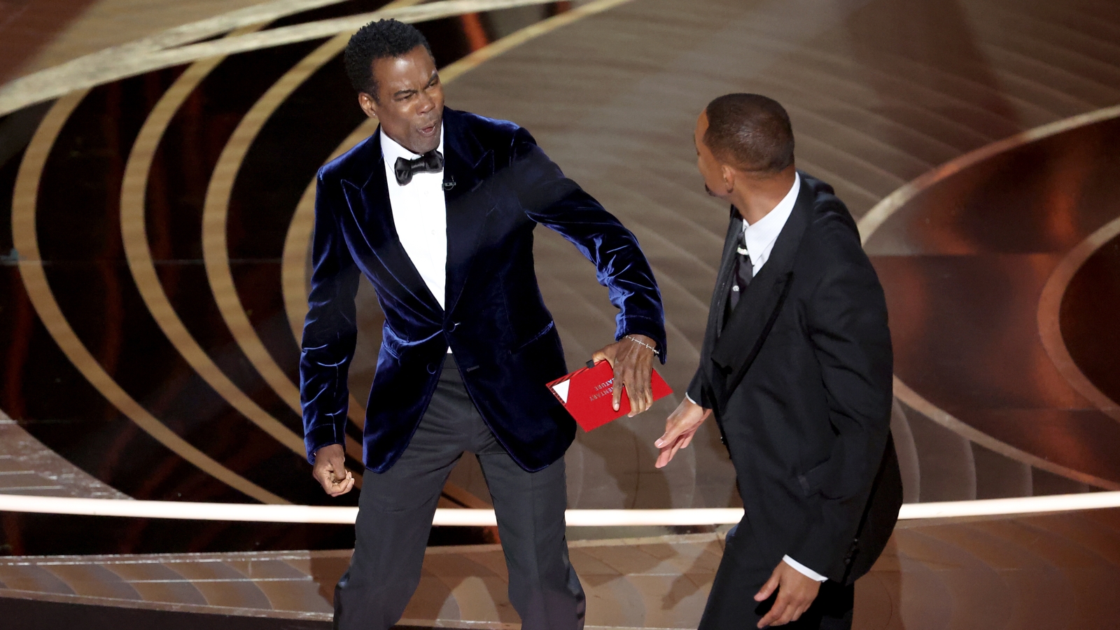 Will Smith hits Chris Rock on stage during Oscars