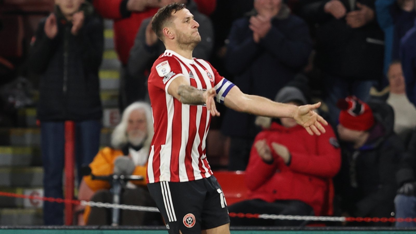 Pitch invader arrested after assault on Blades' Sharp