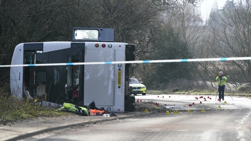 Bus overturns after crash with motorcyle in England