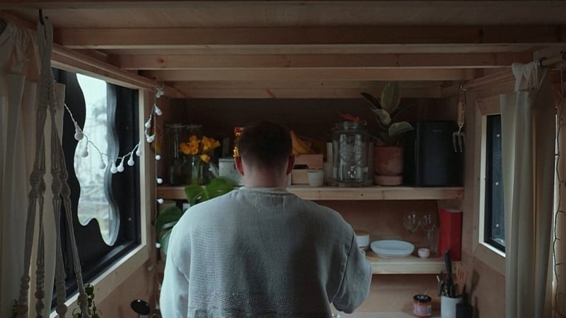 London artist moves into skip to highlight rent crisis