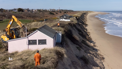 Clifftop houses demolished in east England over erosion