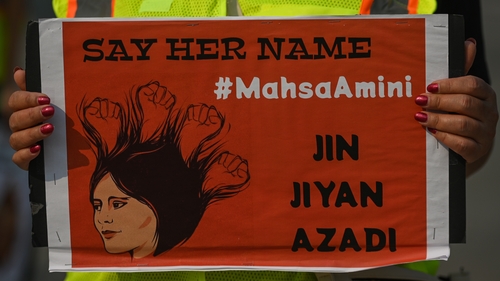 Iran guard fatally shot on anniversary of Amini death