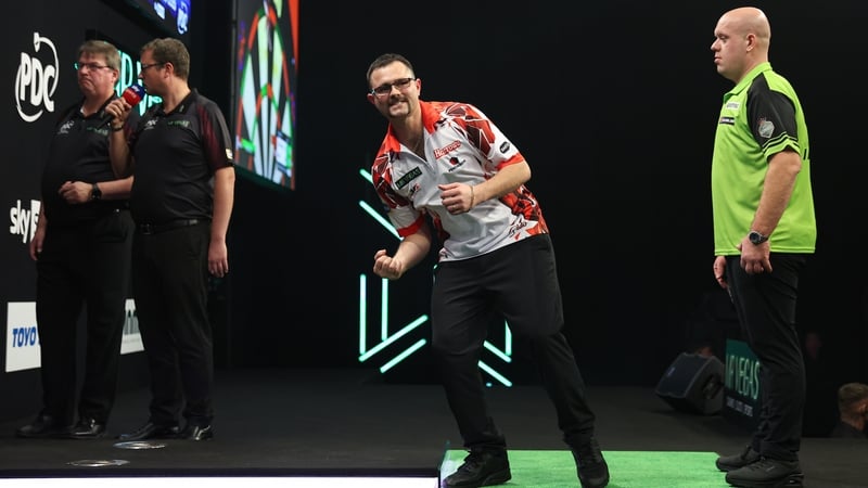 Heta beats Van Gerwen to reach Grand Slam last-eight