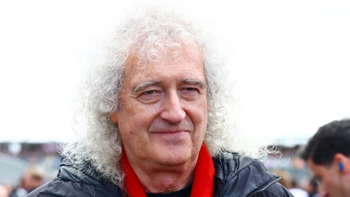 Queen's Brian May waves chequered flag at Silverstone