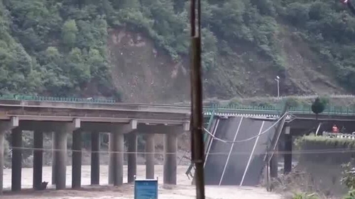China bridge collapse kills 11 after torrential rains