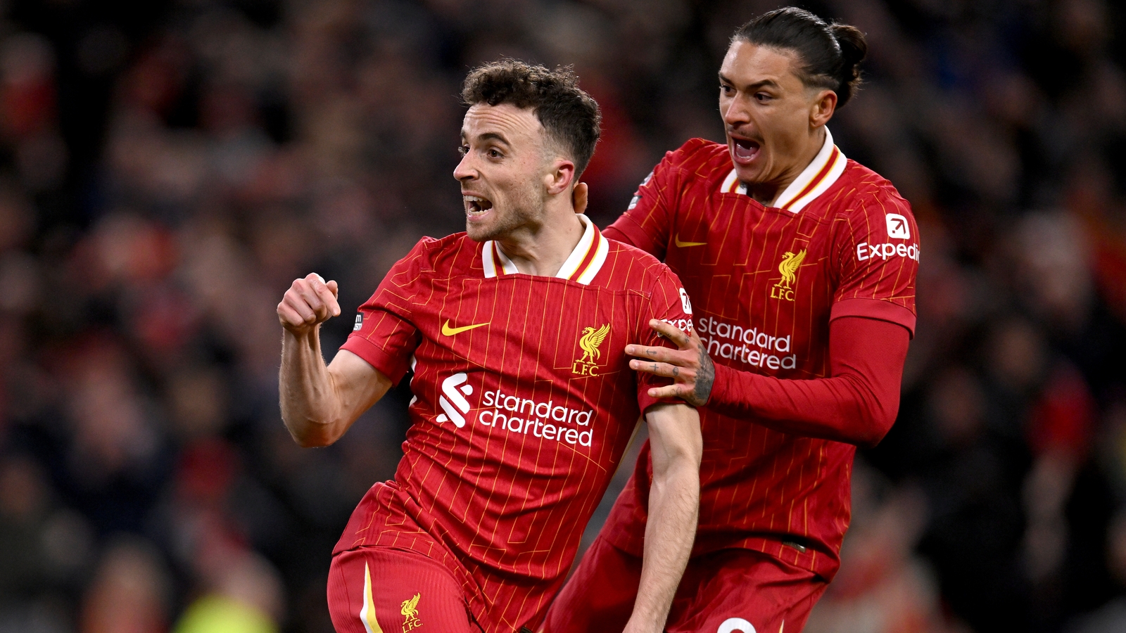 Liverpool's 10 men fight back twice for crucial point
