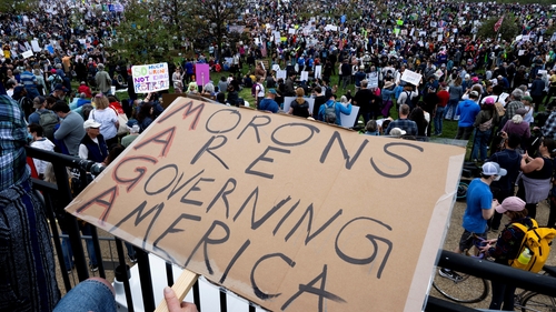 Tens of thousands march in US against Donald Trump
